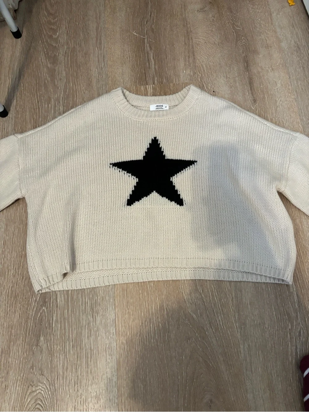 Ardene | Tops | Ardene Cream Sweater With Black Star | Poshmark